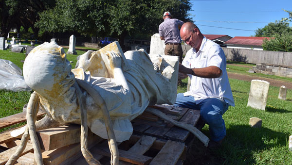 Legendary cemetery angel back on pedestal, ready for repair work in ...